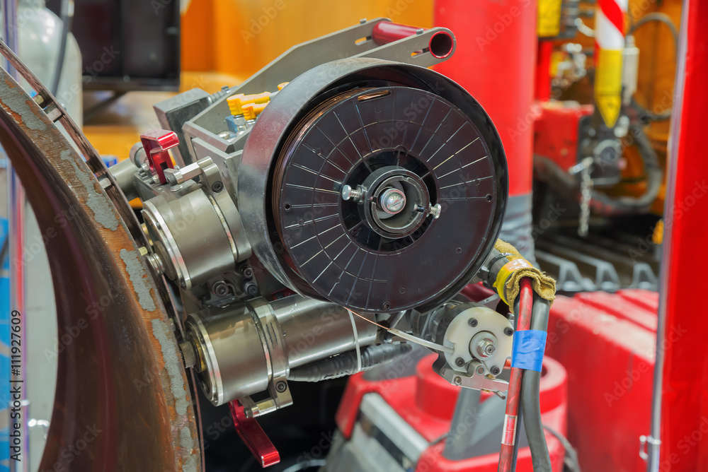 automated robot with wire spool for welding gas and water pipes Stock ...