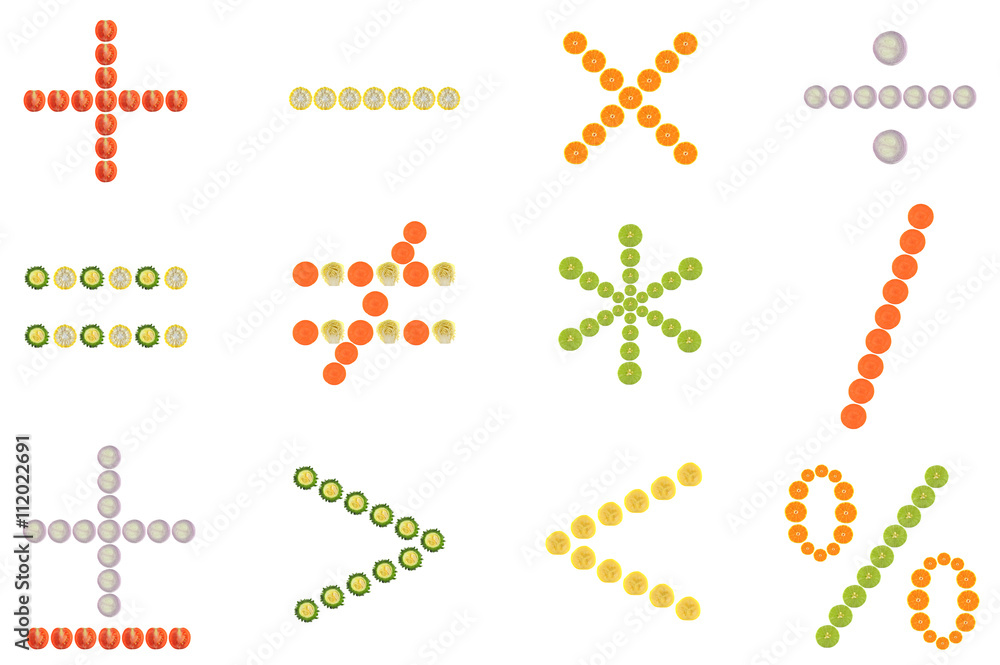 Mathematical symbol from halves of fruit and vegetable on white ...