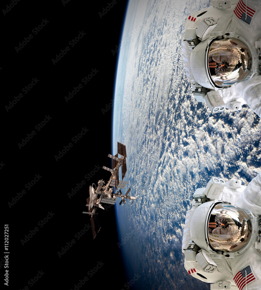 Planet Earth two astronauts spaceman helmet suit outer spacewalk ...