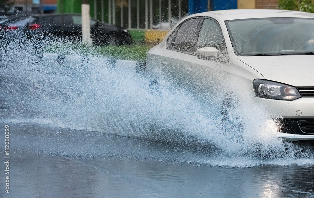 car rain puddle splashing water Stock Photo | Adobe Stock