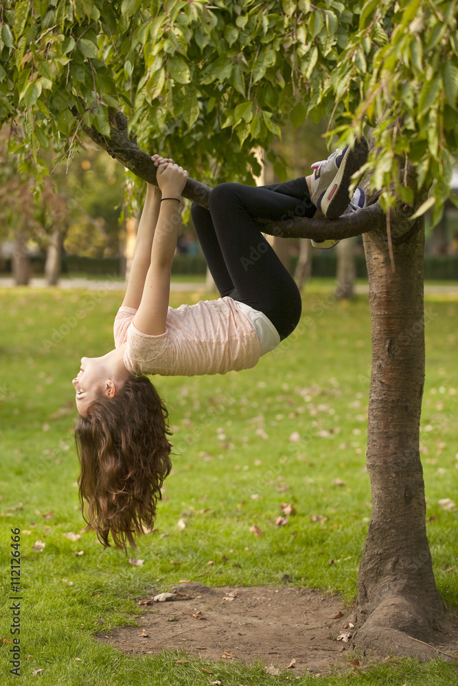 Girl Hanging From Tree