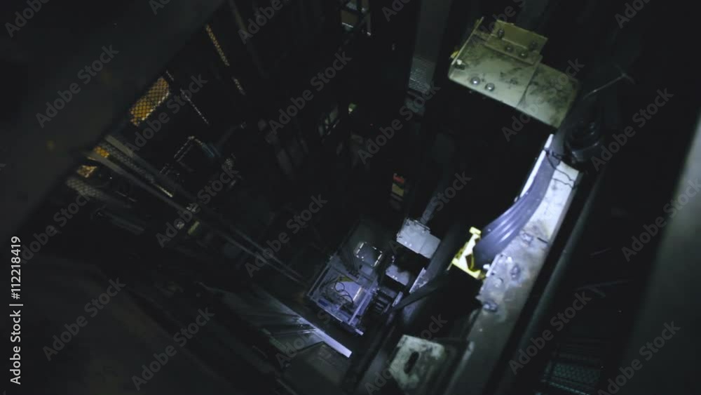 Lift Moves Down. Mechanism of the Back Side of the Elevator. Lift Shaft ...
