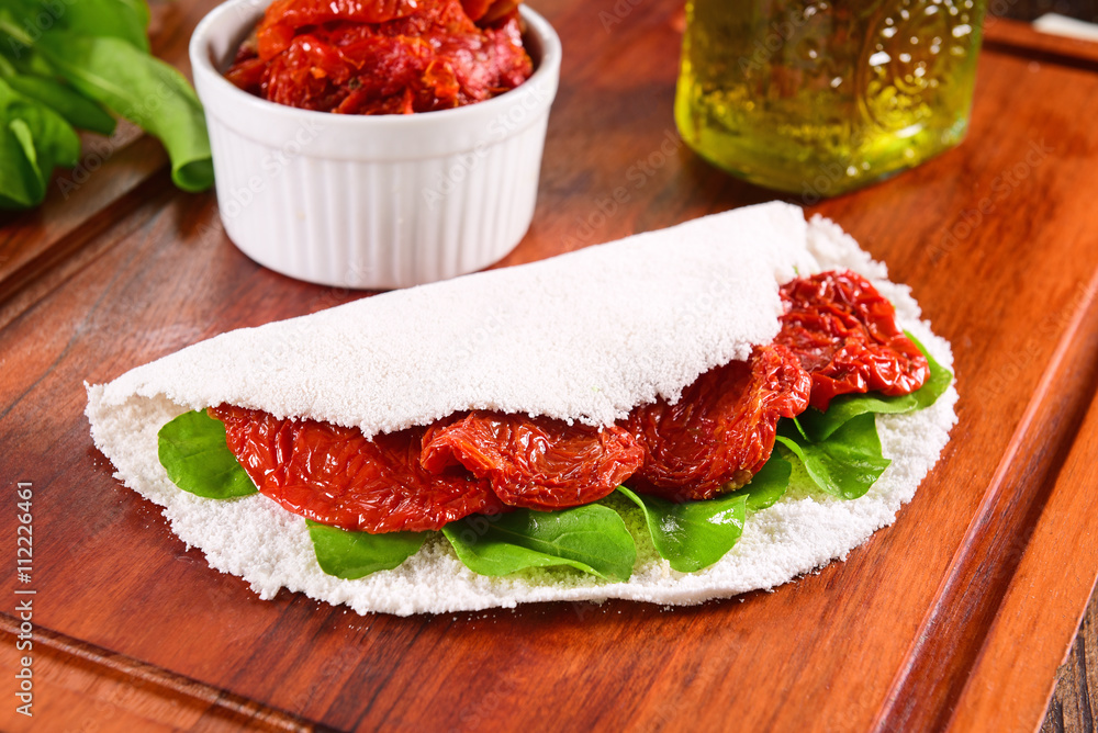 Sun dried tomatoes and rocket salad - Tapioca Stock Photo | Adobe Stock