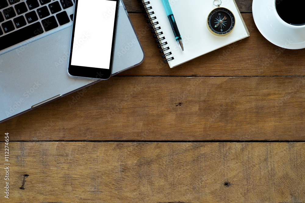 Office workspace with laptop,blank screen smartphone, coffee cup ...
