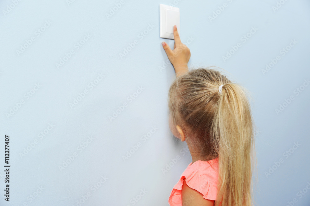 Cute little girl playing with switch Stock Photo | Adobe Stock