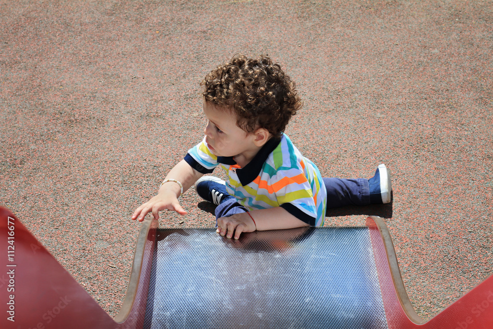 Little boy fell sliding down, injury on playground . Child Sliding on a ...