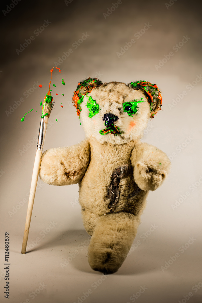 Teddy bear as a wizard holding paintbrush Stock Photo | Adobe Stock