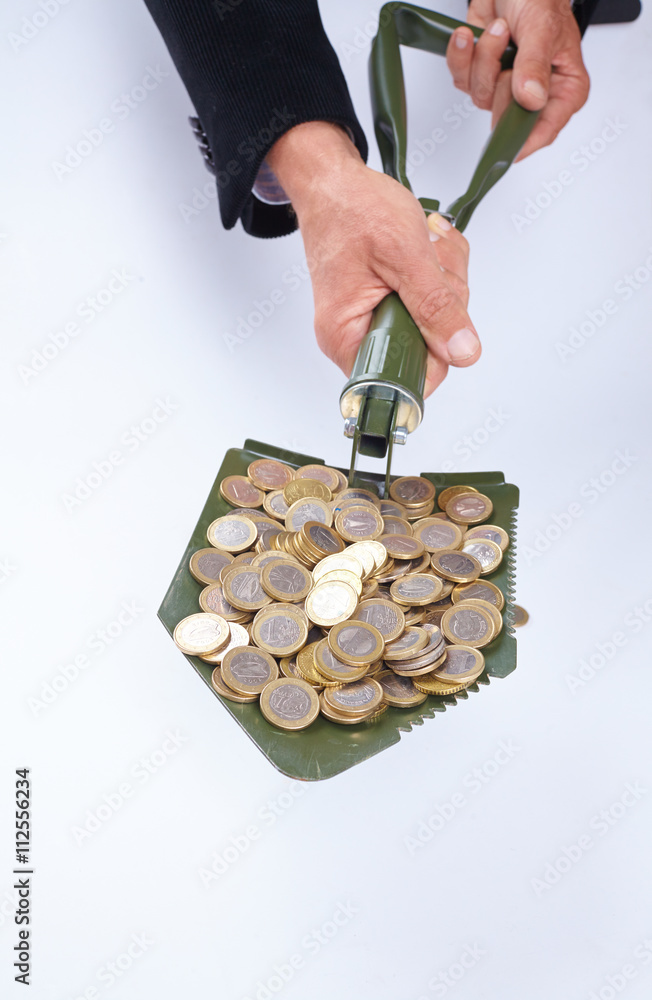 shovel with money Stock Photo | Adobe Stock