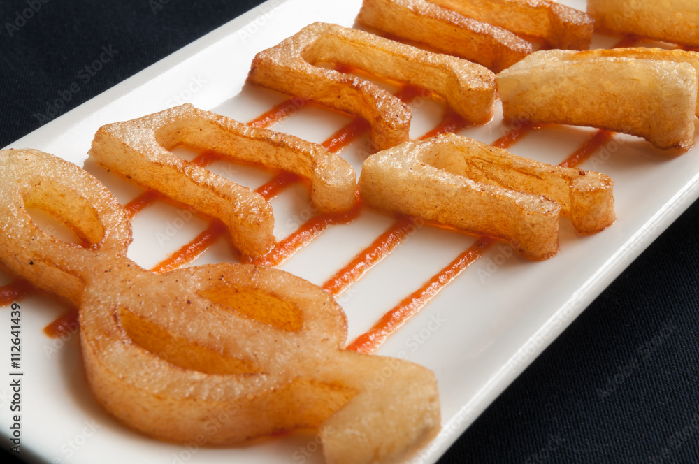 French fries with the form of musical notes and treble clef Stock Photo ...