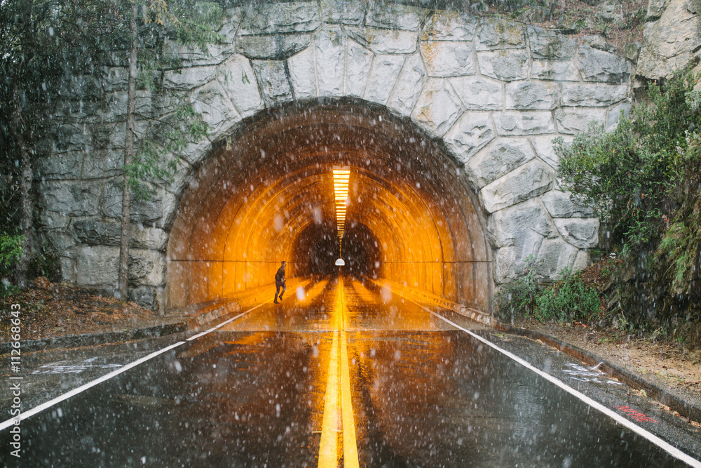 Person running through tunnel Stock Photo | Adobe Stock