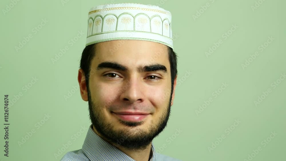 Video Stock Portrait of a young arabic muslim man wearing a typical ...