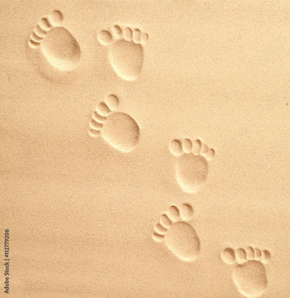 Overhead view of path made by child footprints Stock Photo | Adobe Stock