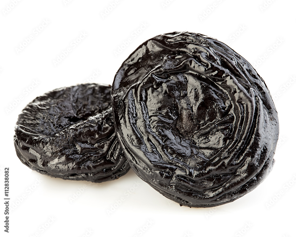 Raw organic prunes, dried plums, smoked prunes close-up on a white ...
