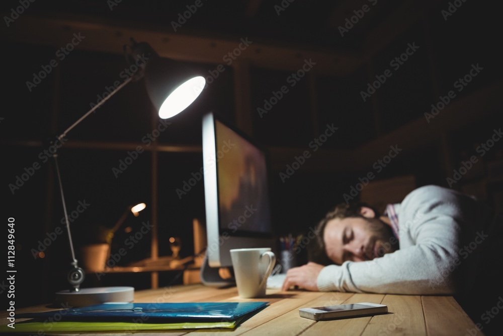 Man sleeping on his desk Stock Photo | Adobe Stock