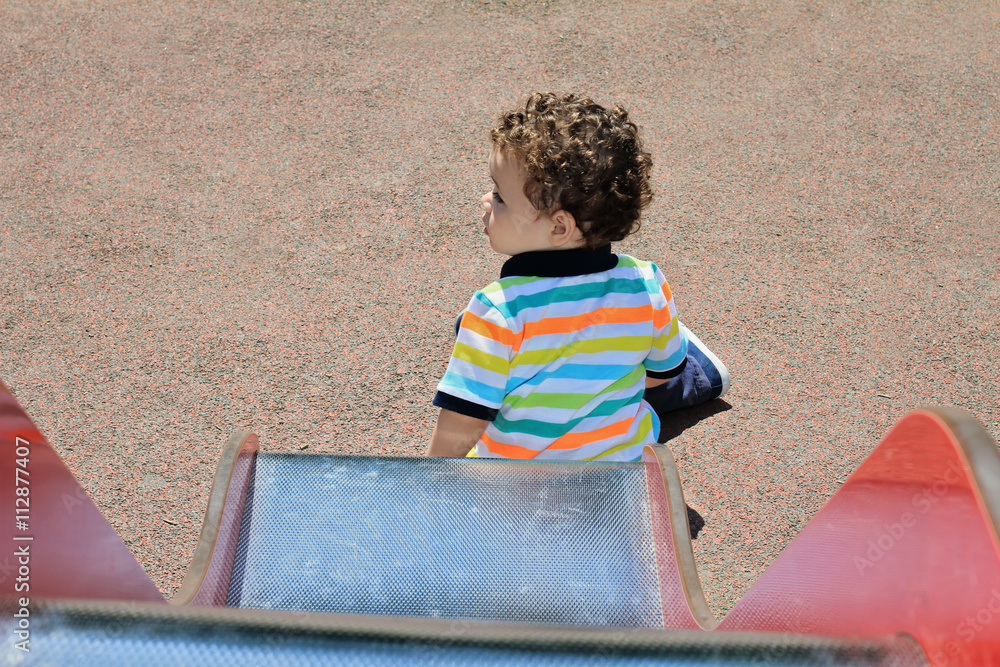 Little boy fell sliding down, injury on playground . Child Sliding on a ...