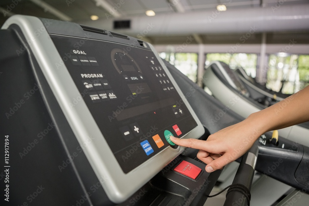 Hand of a person setting control panel of treadmill Stock Photo | Adobe ...