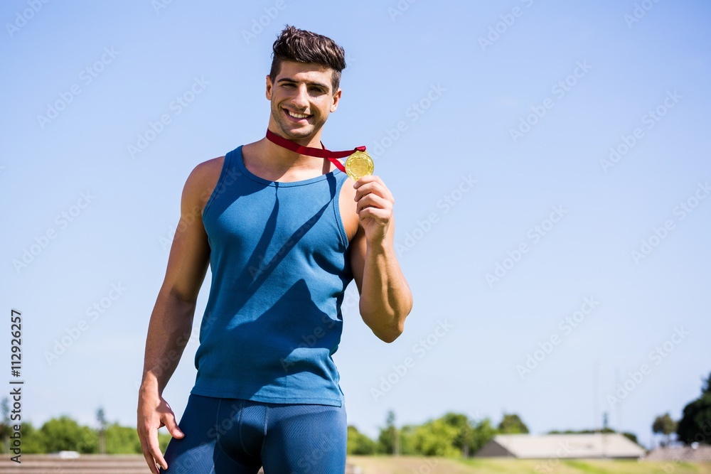 Athlete showing his gold medal Stock Photo | Adobe Stock