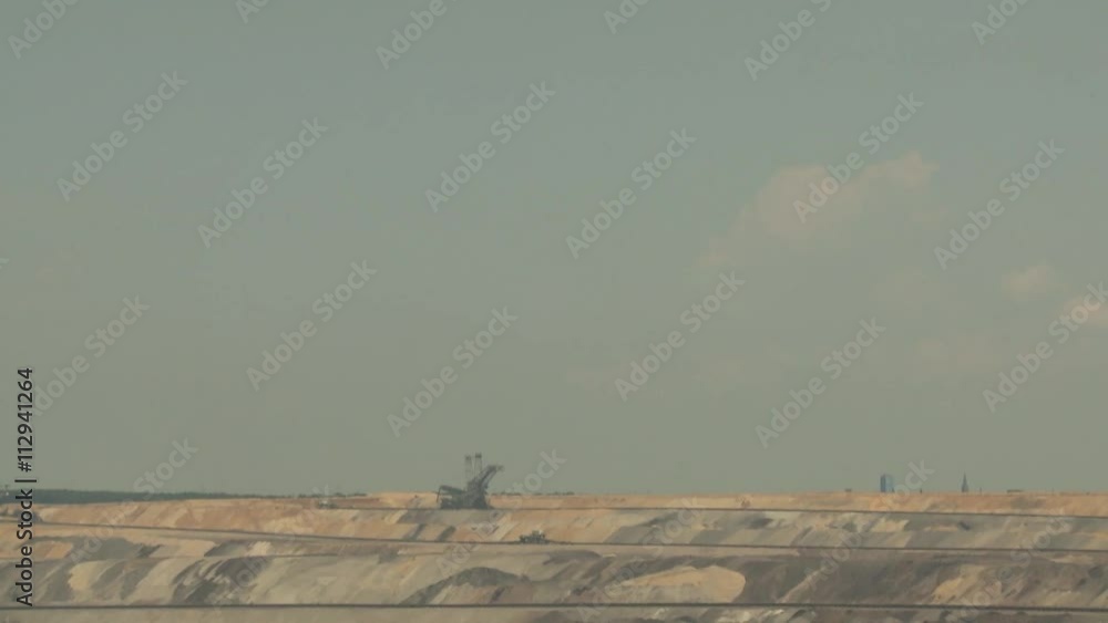 Open-cast mining. Tilt from sky to soil. Establishing shot. Surface ...