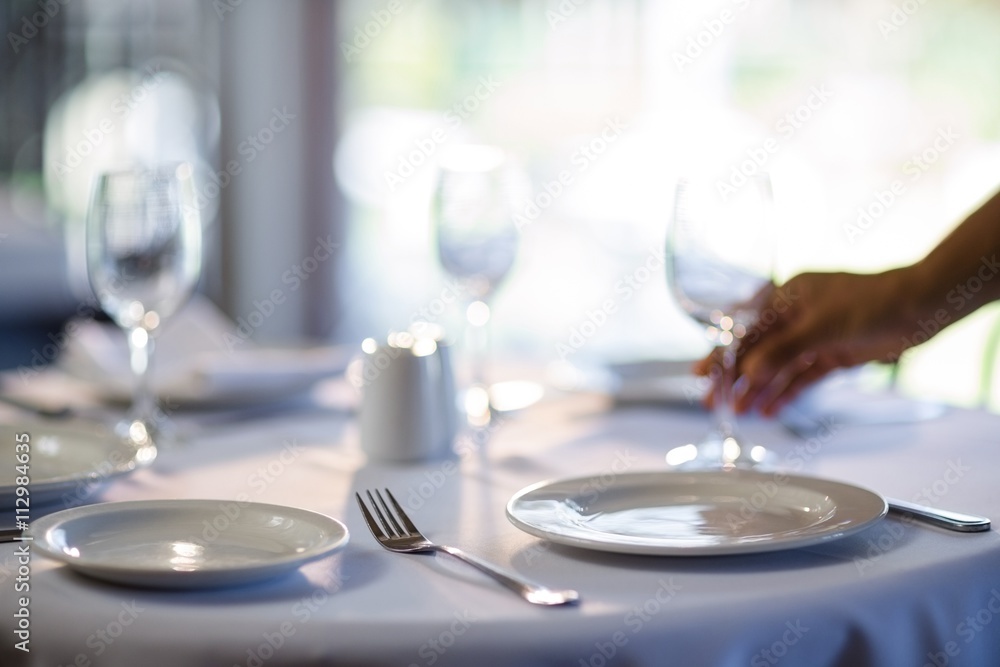 Waitress setting the table Stock-Foto | Adobe Stock