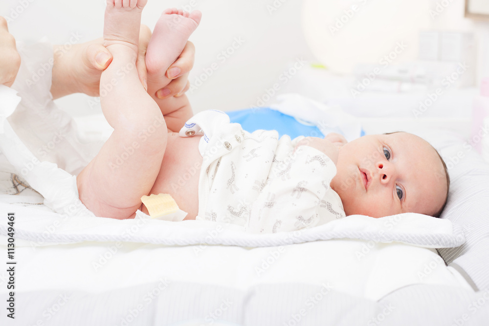 Changing the diaper of a newborn Stock Photo | Adobe Stock