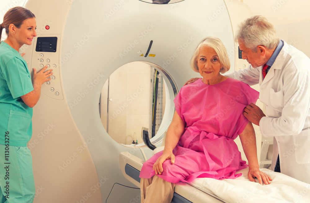 Old female patient undergoing mri in hospital assisted by doctor Stock ...