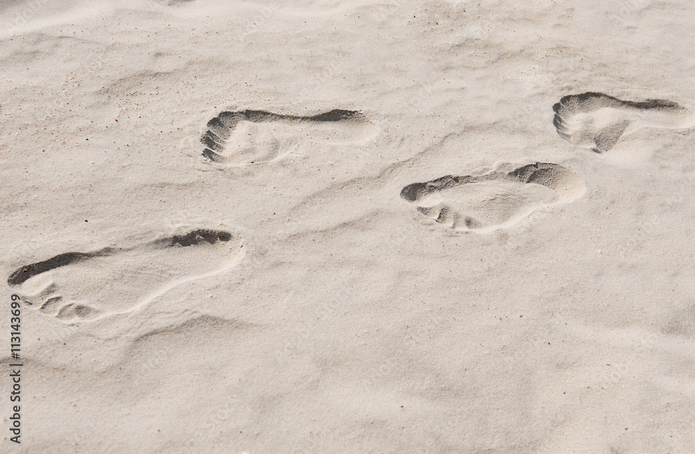 Footprints in the sand, sea, human footprints in the sand on the beach ...