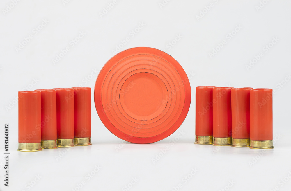 Clay pigeons and shotgun shells Stock Photo | Adobe Stock
