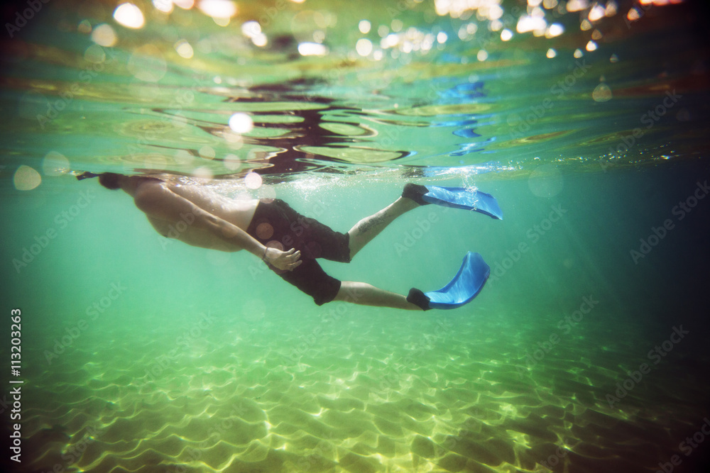 Person Swimming Underwater Side View