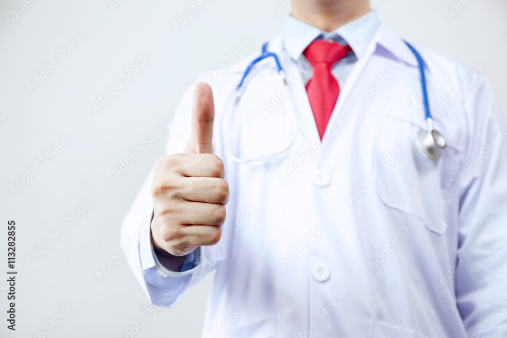 Close up of doctor giving thumbs up in white isolated background Stock ...