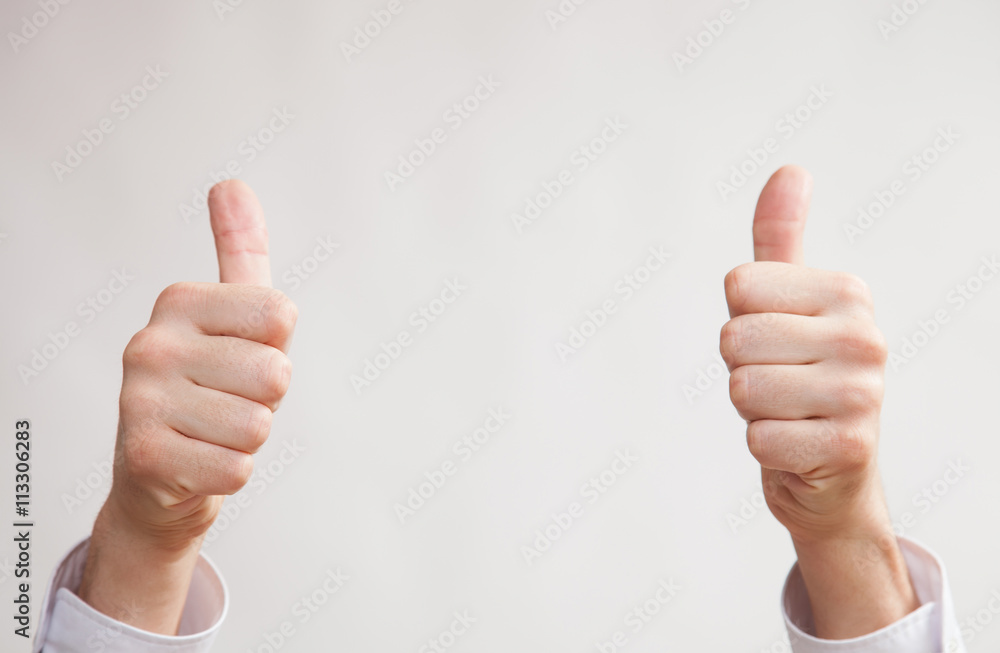 Male hand showing a thumbs up sign Stock Photo | Adobe Stock