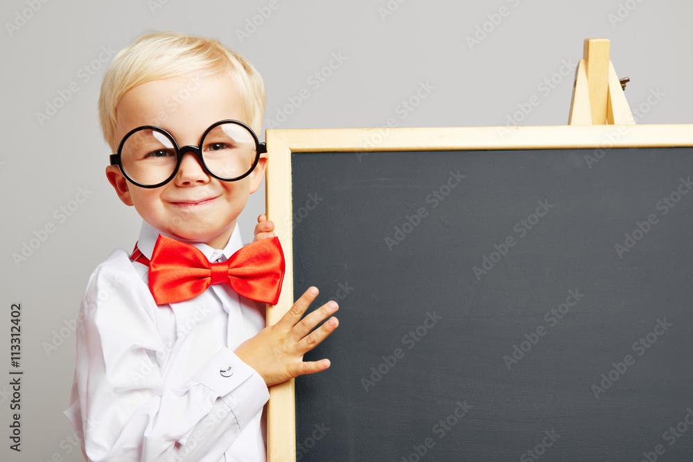 Kind als Professor neben Tafel in Schule Stock Photo | Adobe Stock