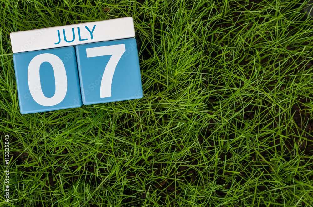 July 7th. Image of july 7 wooden color calendar on greengrass lawn ...