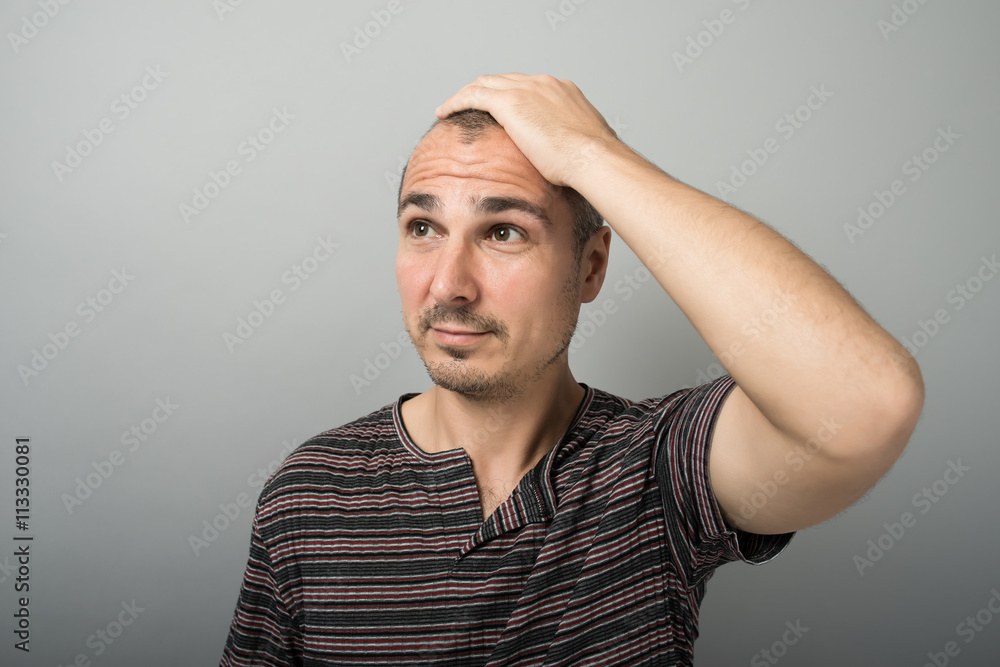 man holding his head Stock-Foto | Adobe Stock