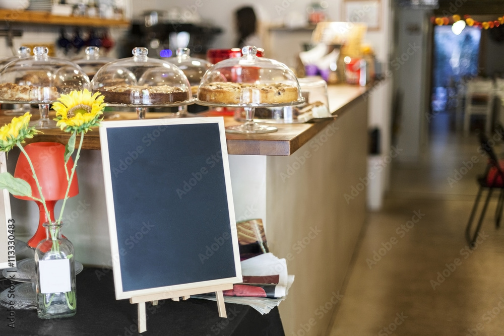 Cake counter and welcome board in small cafe Stock Photo | Adobe Stock