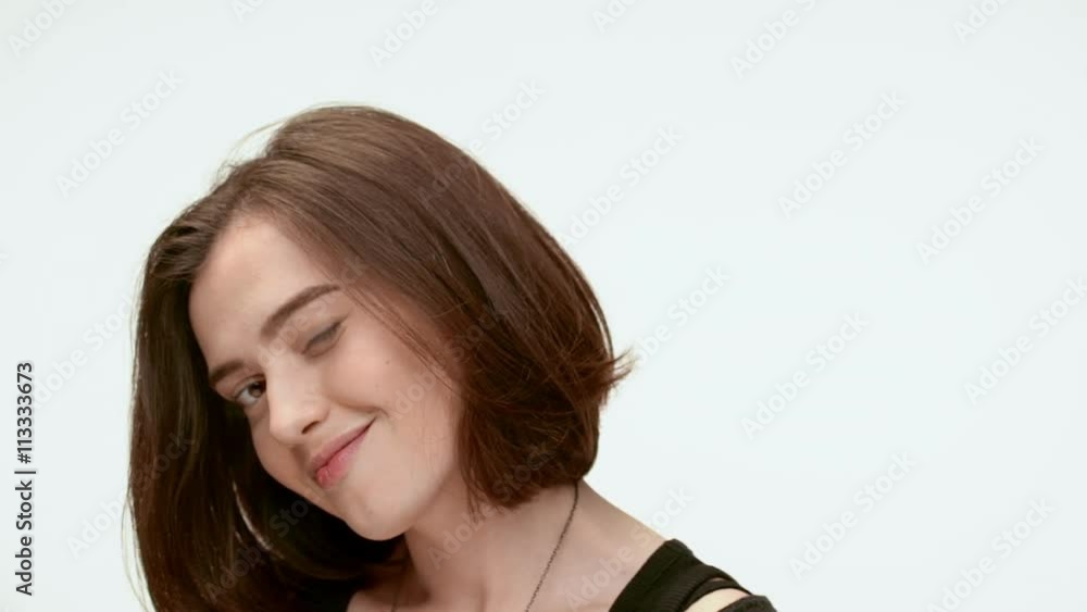 Cute pretty girl winking. Close up. Slow motion Stock Video | Adobe Stock