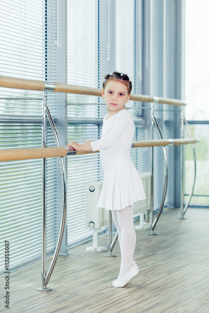 Little ballerina girl. Adorable child dancing classical ballet in a ...