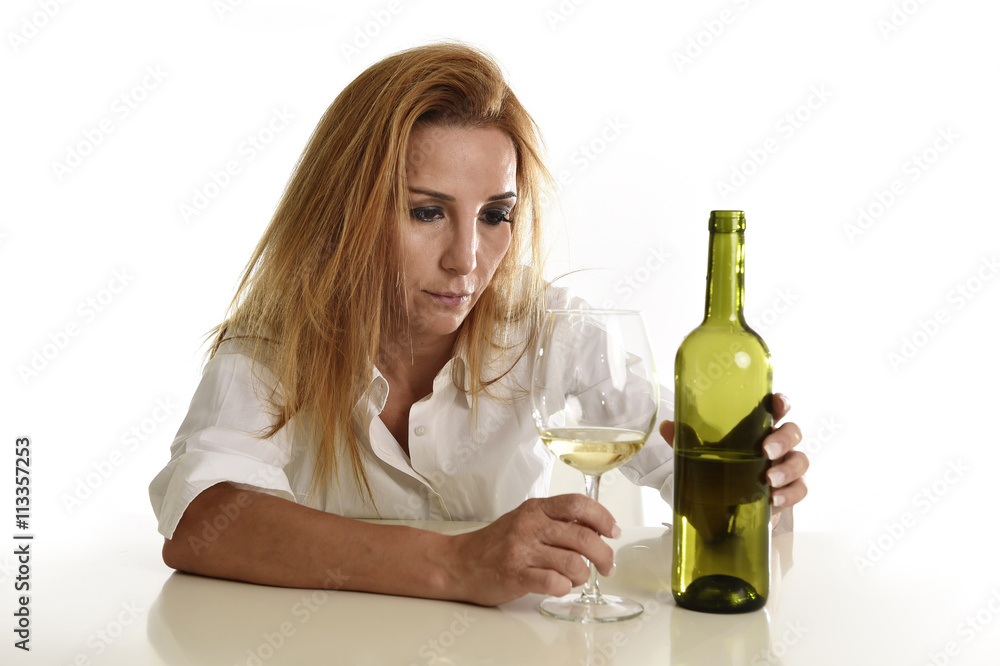 blond wasted and depressed alcoholic drunk woman drinking white wine glass desperate sad Stock ...