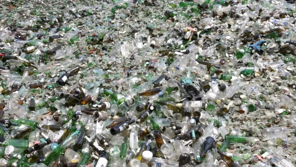 Glass waste for recycling in a recycling facility. Different glass ...