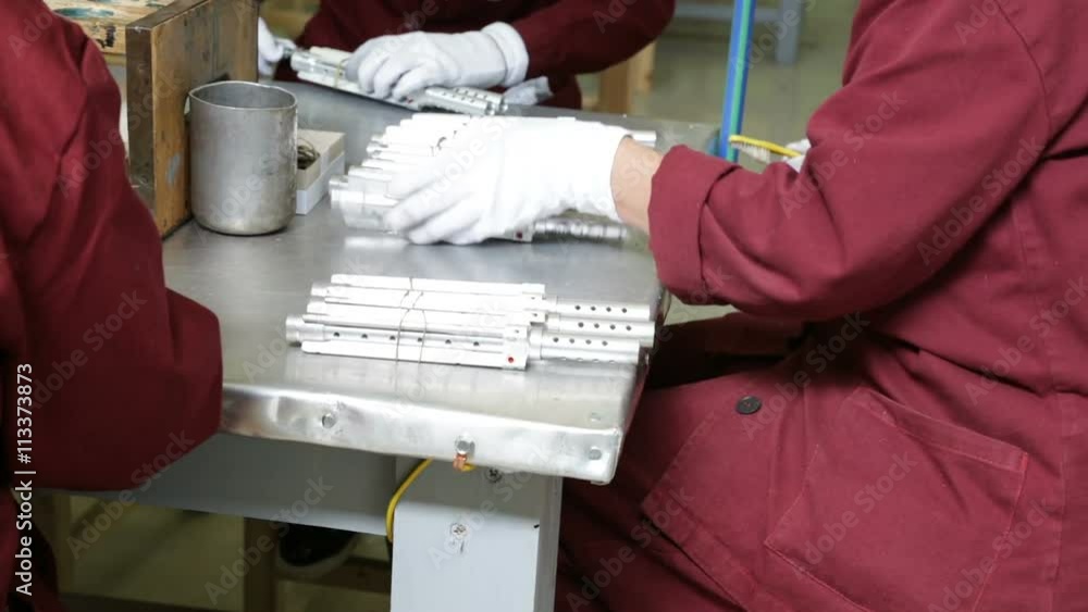 Workers are preparing explosive triggers of anti tank rocket-propelled ...