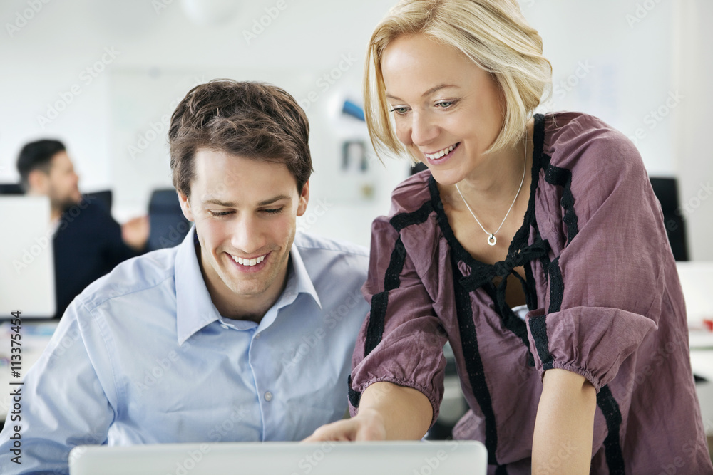 Two people helping each other at the office Stock Photo | Adobe Stock
