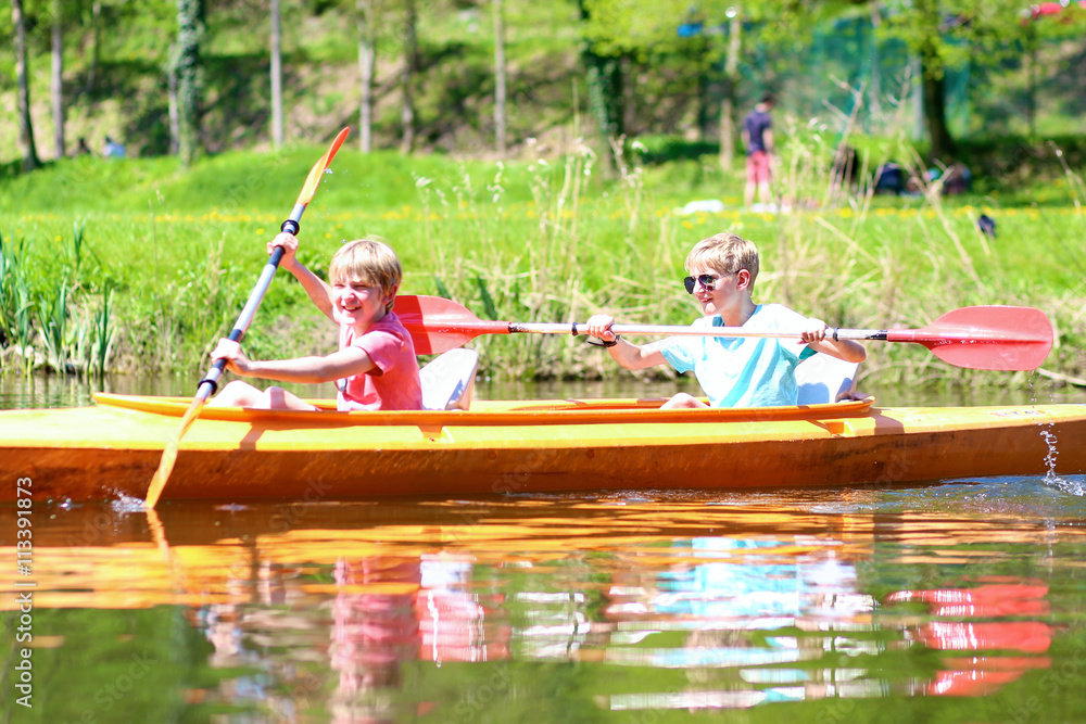 Two boys kayaking on the river. Active happy friends, teenage ...