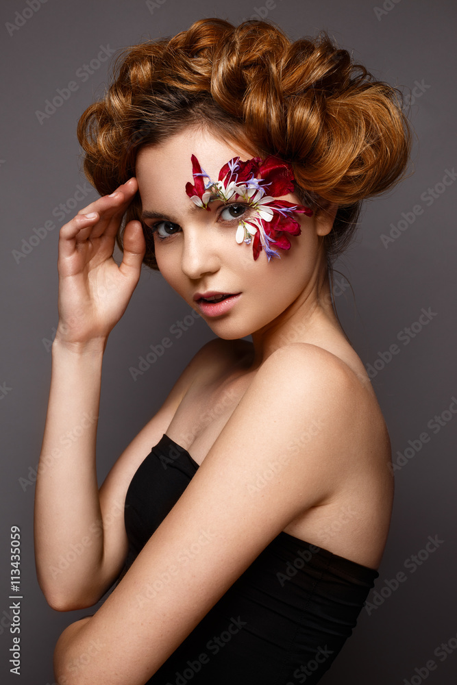 Beautiful girl with creative make-up with floral appliques. The model ...