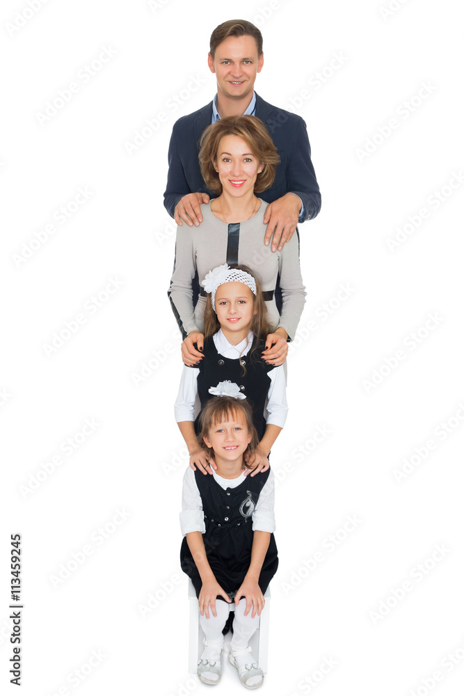 Happy family of four father, mother, and two daughters, are vertical to ...