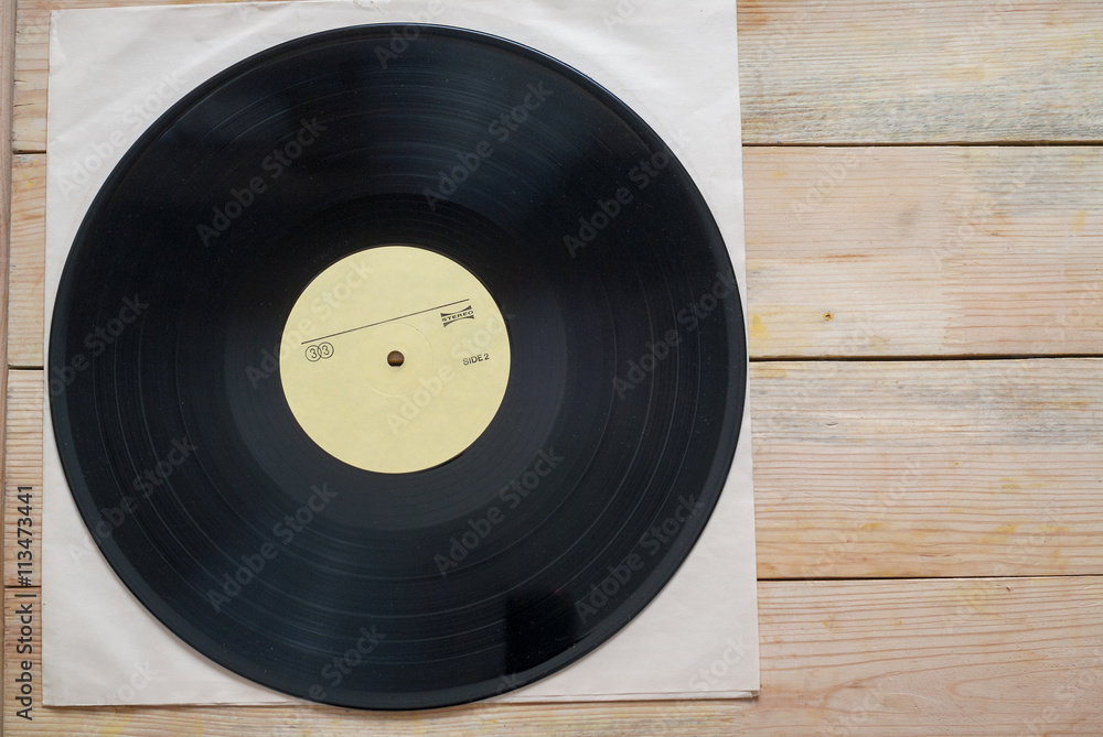 Vinyl record with copy space in front of a collection albums dummy ...