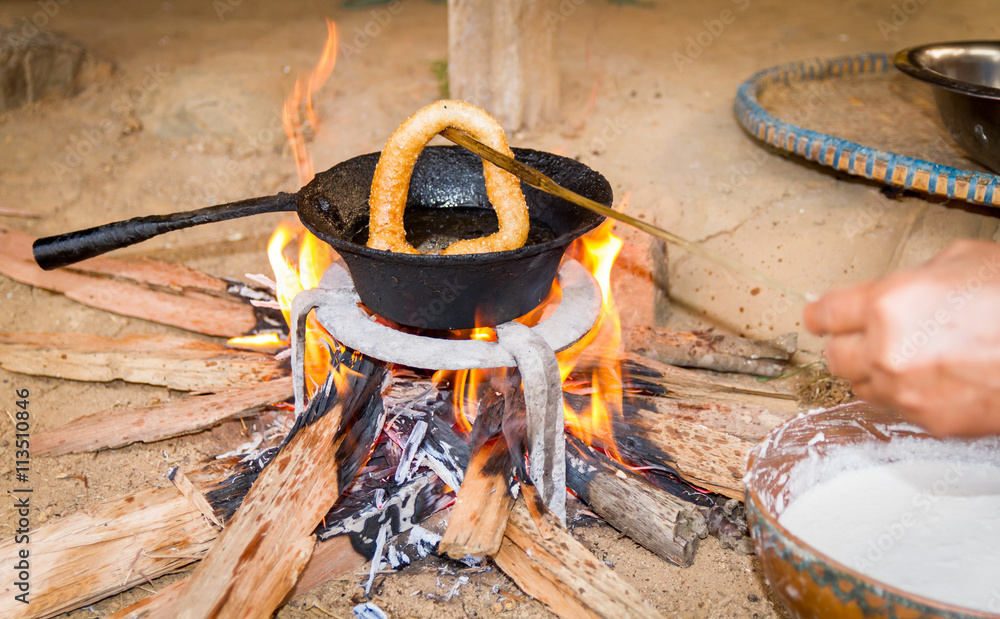 Cooking Sel Roti or Nepali bread Stock Photo | Adobe Stock