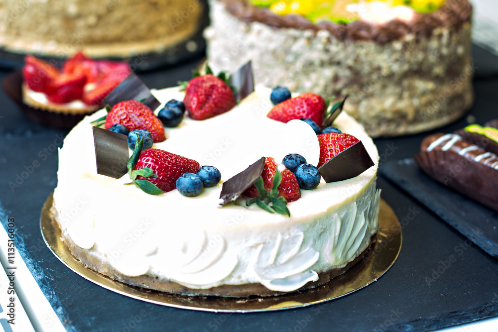Cakes eclairs and cakes on display in the café. Showcases cafes ...