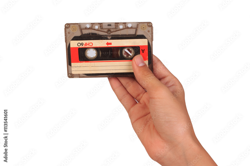 Cassette tape. Hand holding cassette tape isolated on white background ...