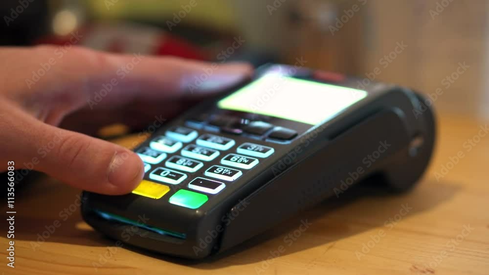 Credit card swipe through terminal machine Stock Video | Adobe Stock