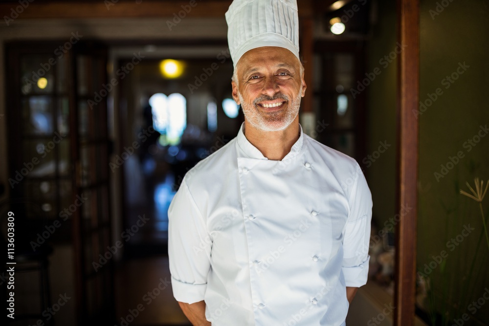 Portrait of chef standing with hands behind back Stock Photo | Adobe Stock