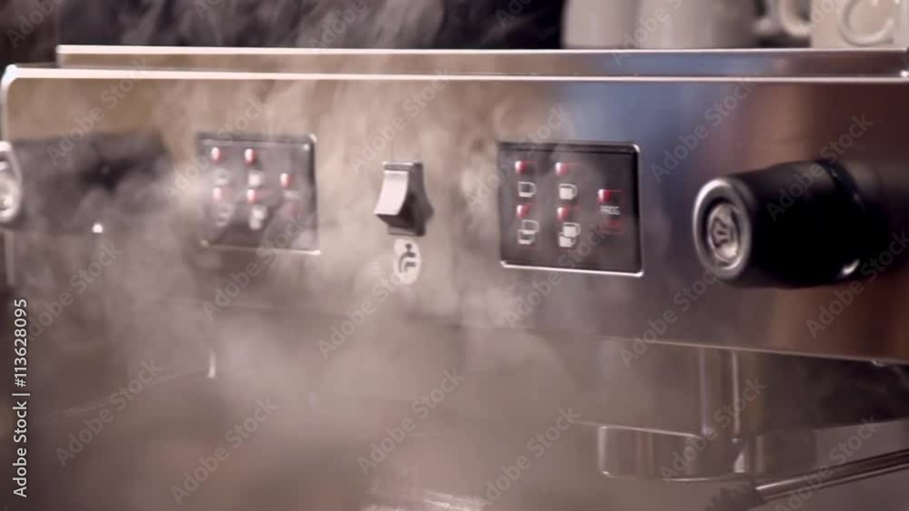 Steam from the coffee machine in slow motion Stock Video | Adobe Stock